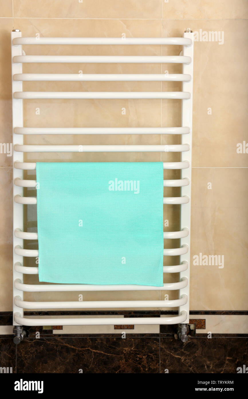 Color towel on radiator in bathroom Stock Photo - Alamy