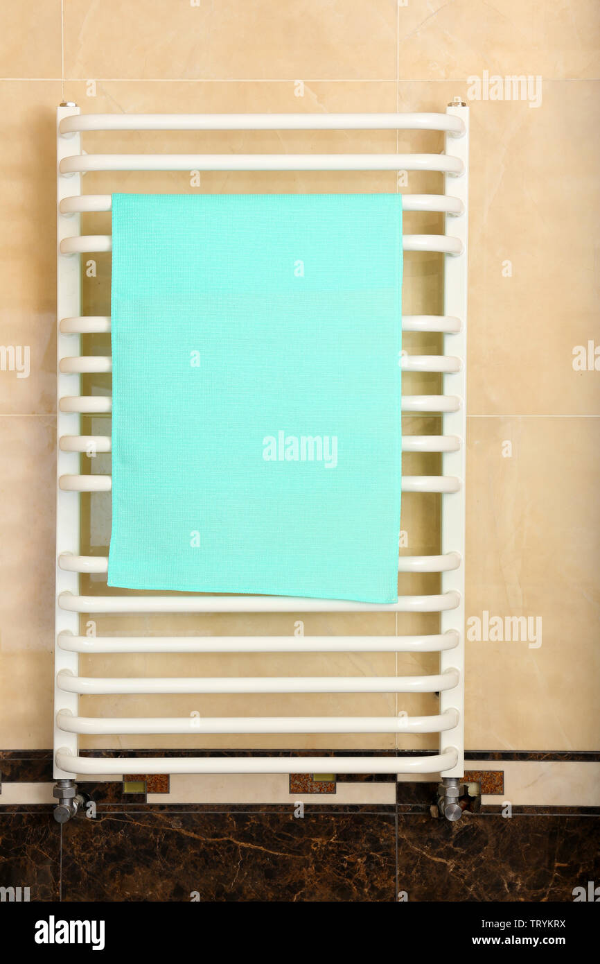 Green towel on radiator in bathroom Stock Photo - Alamy
