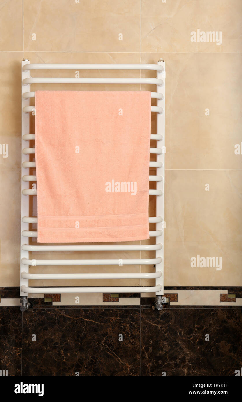 Color towel on radiator in bathroom Stock Photo - Alamy