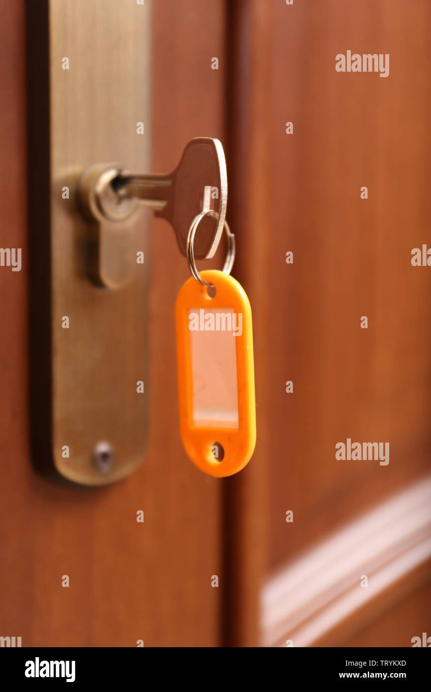 Locking up or unlocking door with key Stock Photo - Alamy