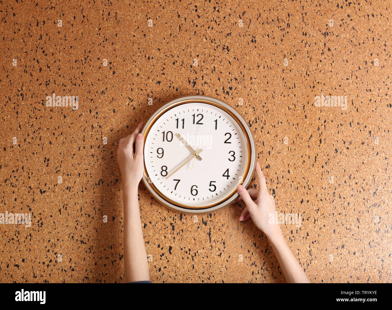 Clock on wall background Stock Photo - Alamy