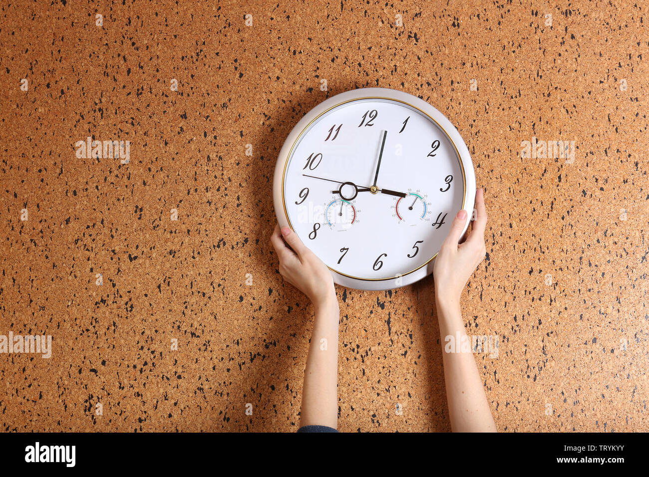 Clock on wall background Stock Photo - Alamy