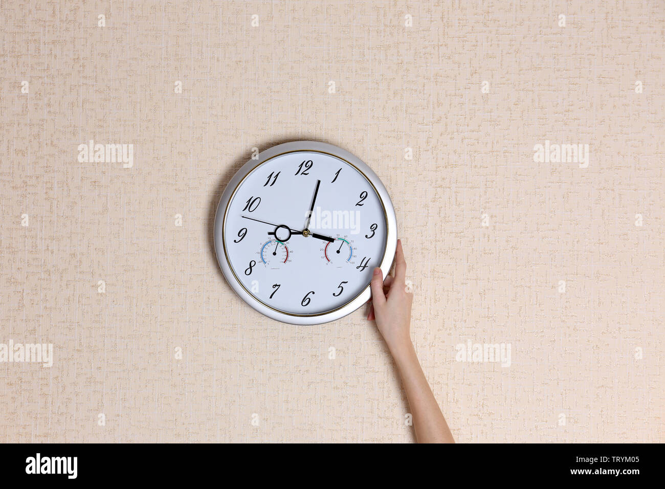 Clock on wall background Stock Photo - Alamy