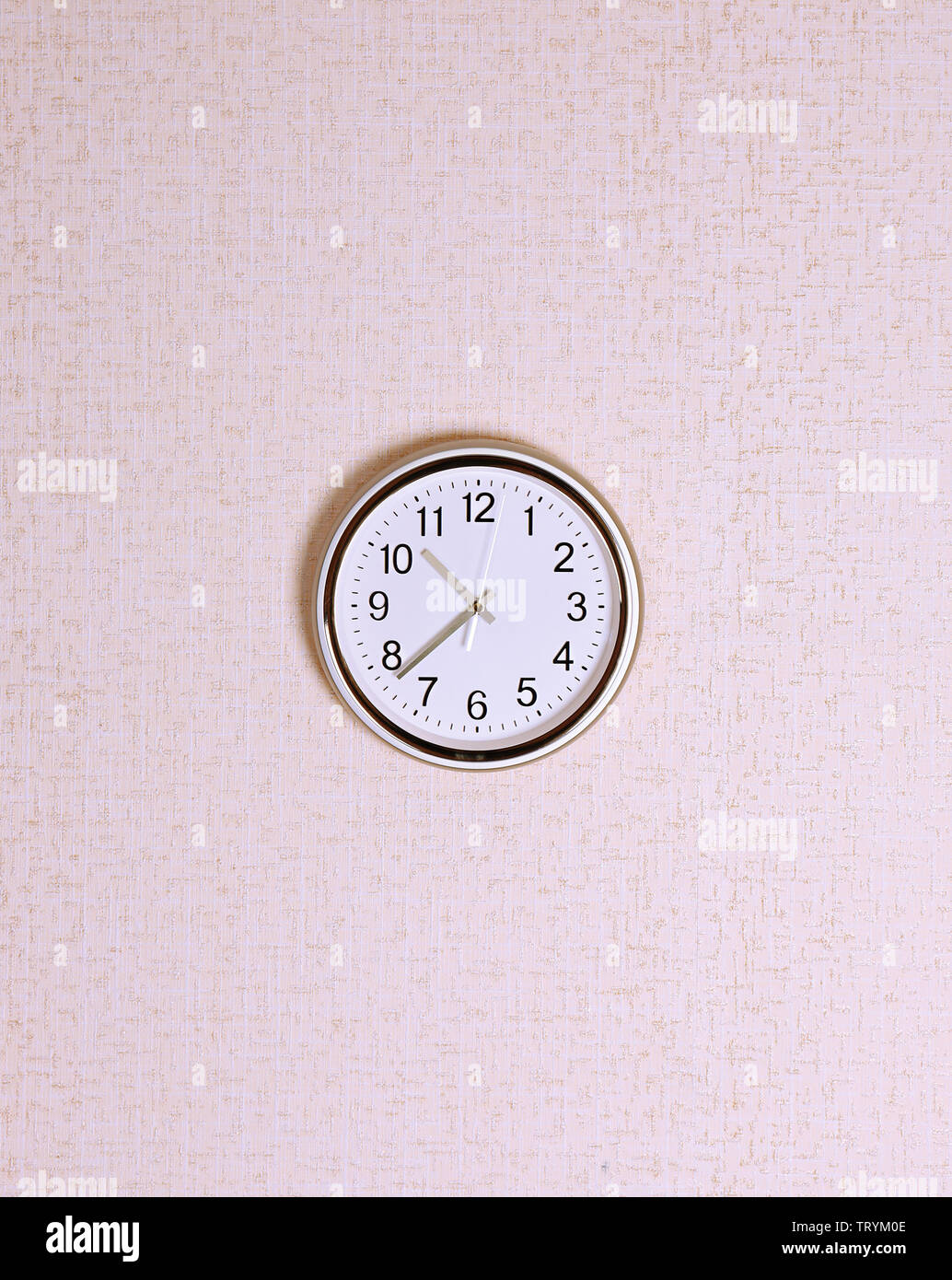 Clock on wall background Stock Photo - Alamy