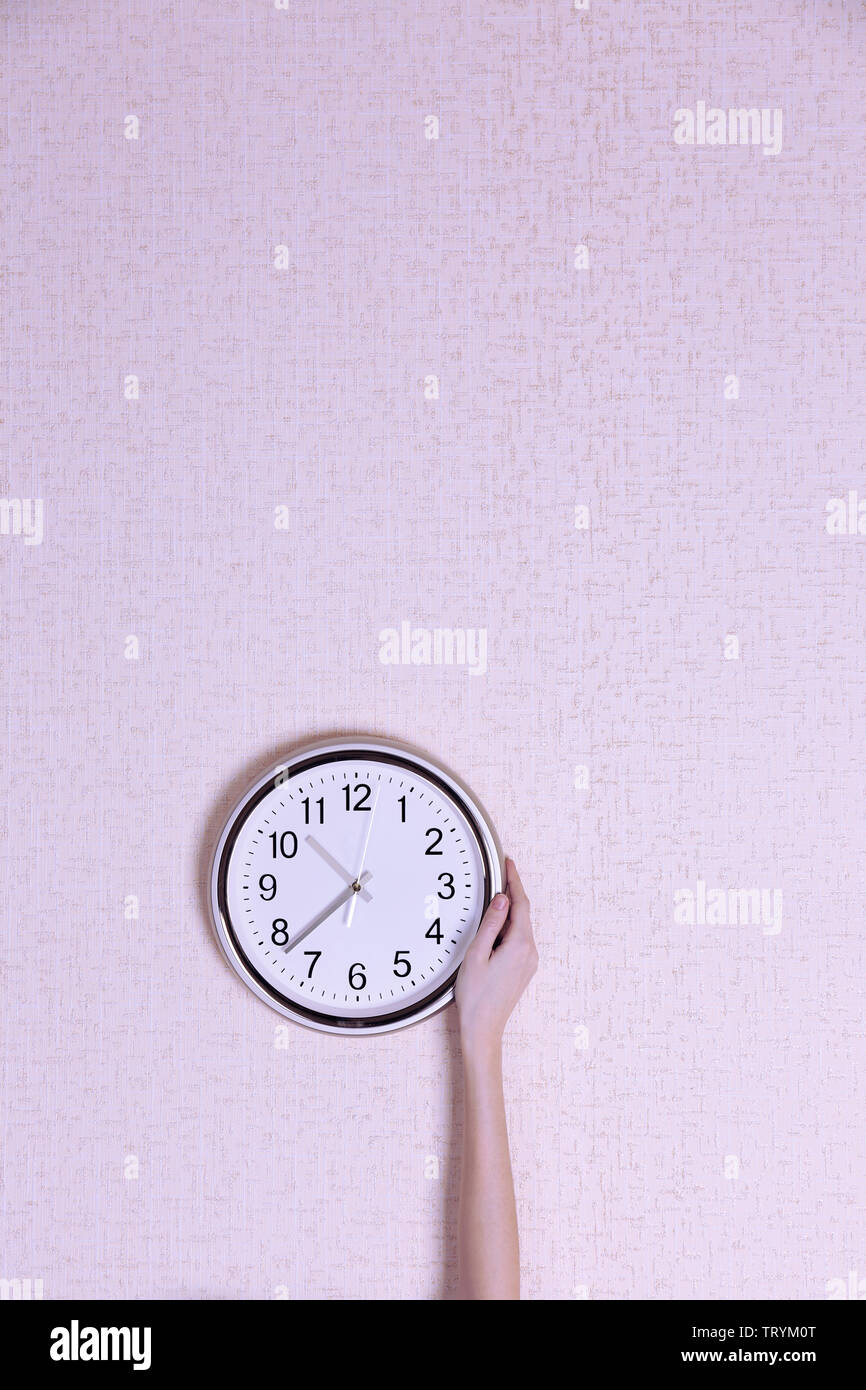 Clock on wall background Stock Photo - Alamy