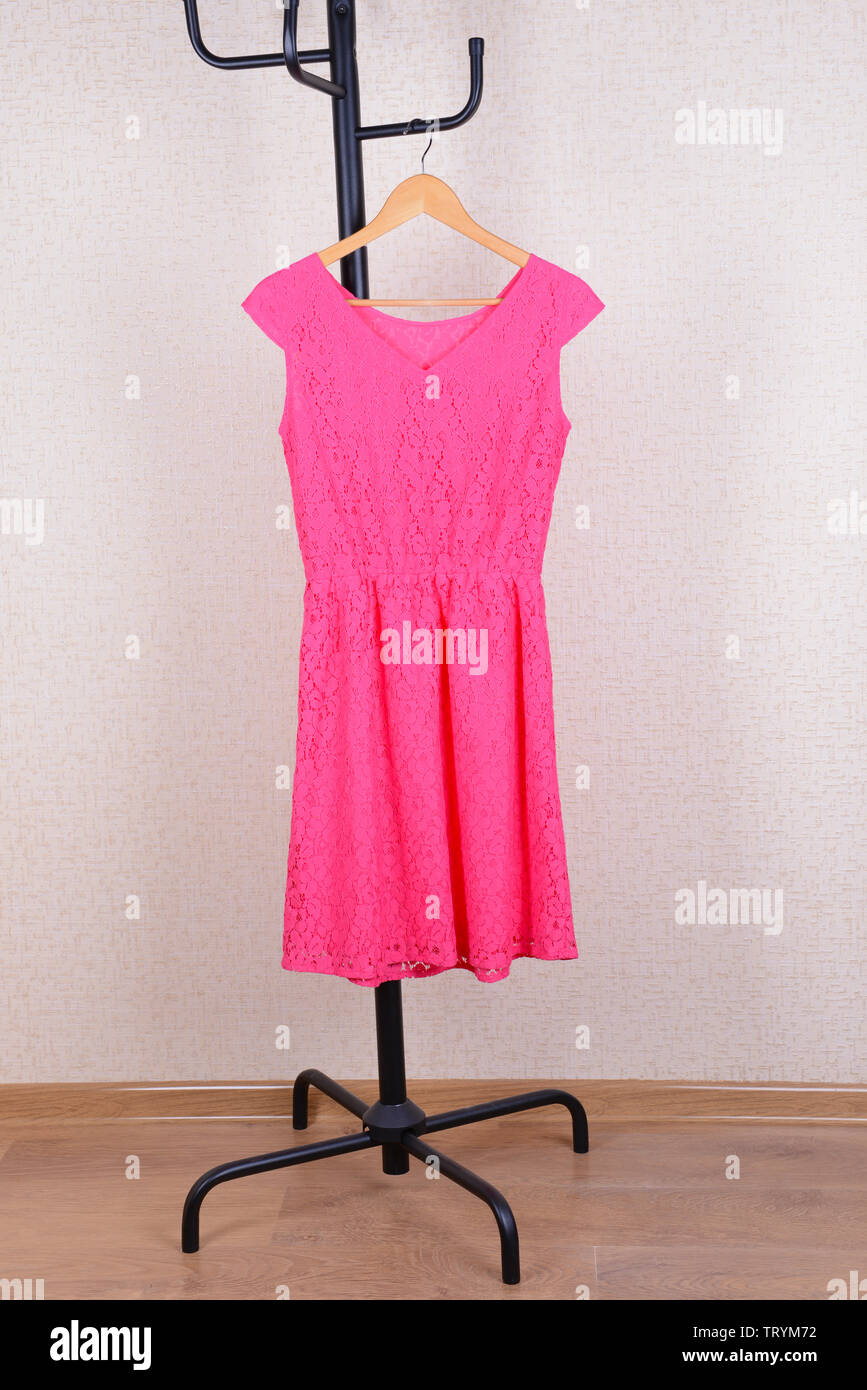 Dress hanging on hanger Stock Photo - Alamy
