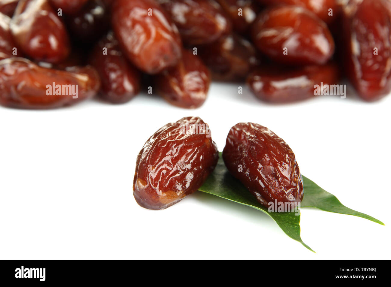 Dried dates isolated on white Stock Photo - Alamy