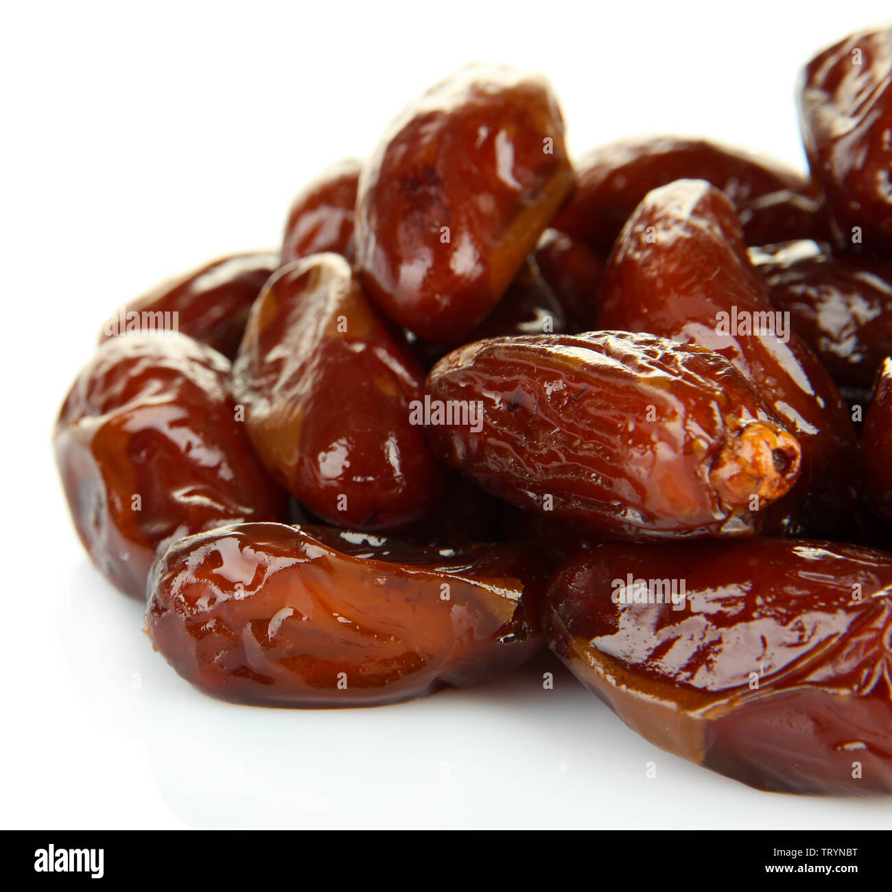Dried dates isolated on white Stock Photo - Alamy