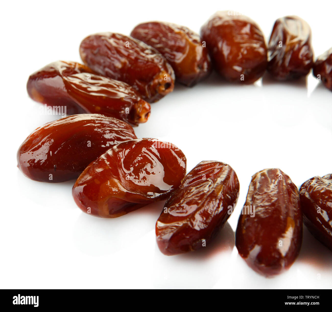 Dried dates isolated on white Stock Photo - Alamy