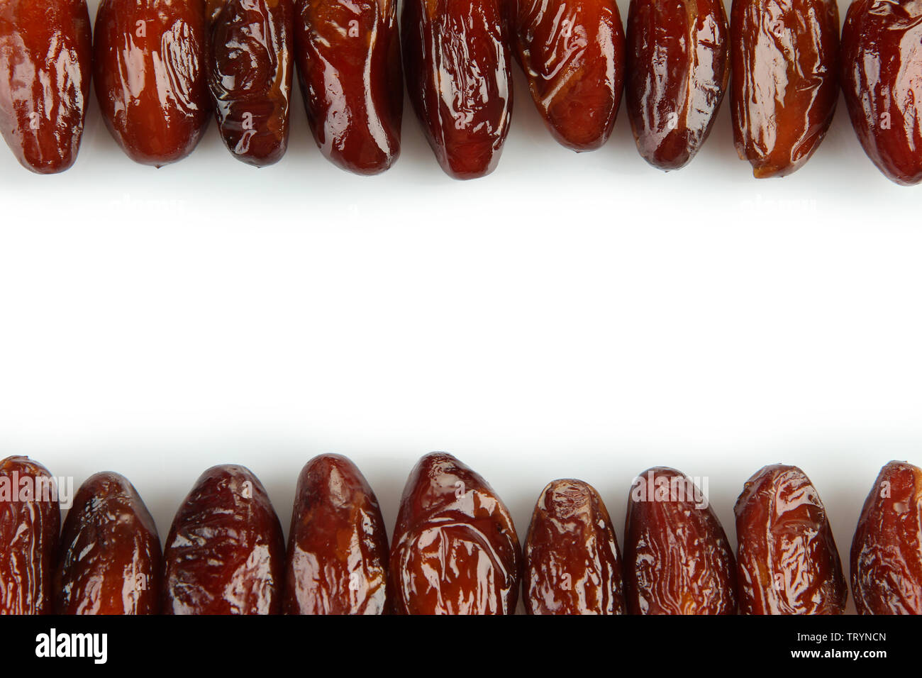 Dried dates isolated on white Stock Photo - Alamy