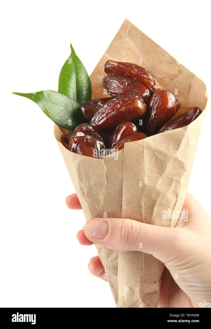 Dried date fruits in hand hi-res stock photography and images - Alamy