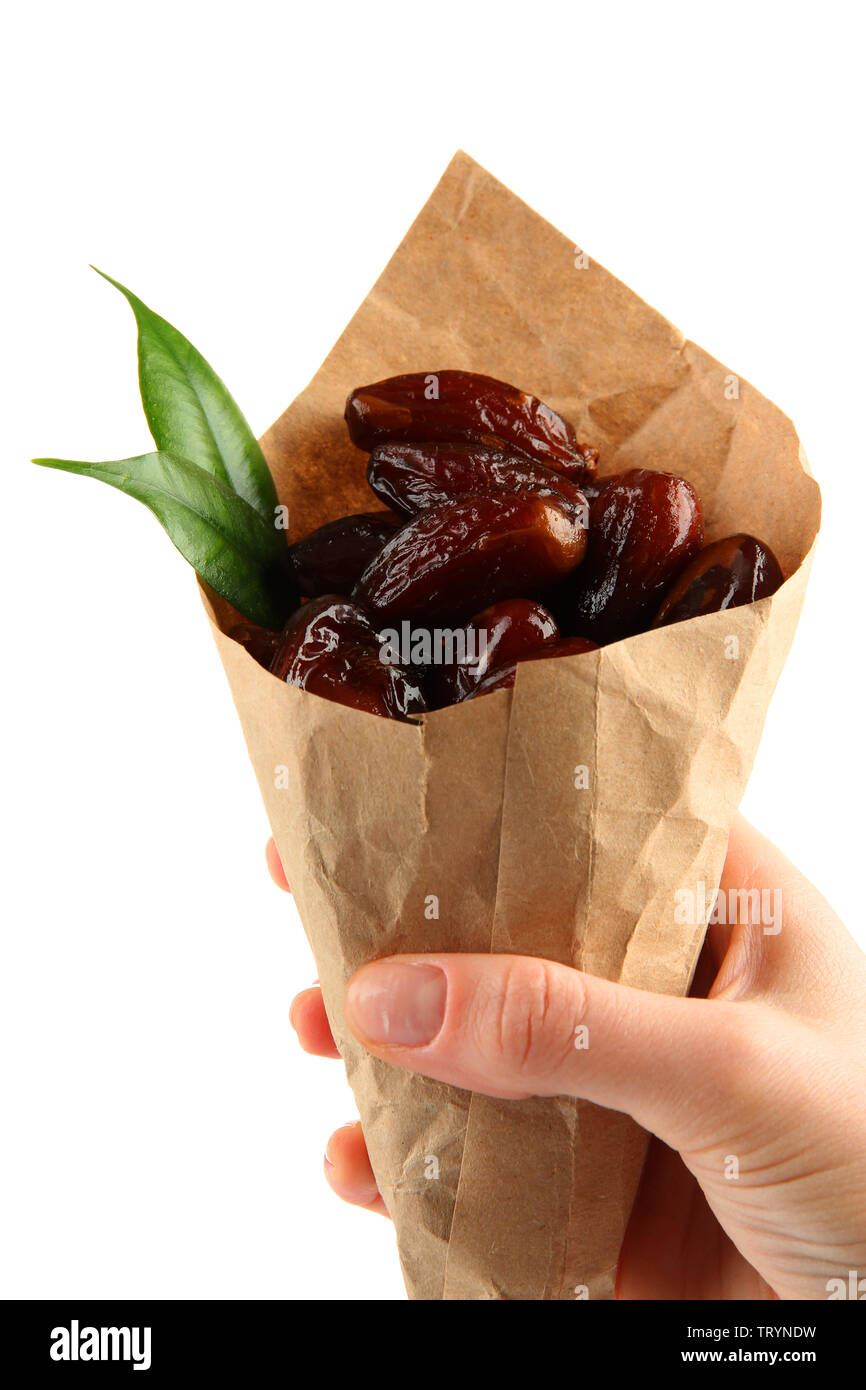 Dried date fruits in hand hi-res stock photography and images - Alamy