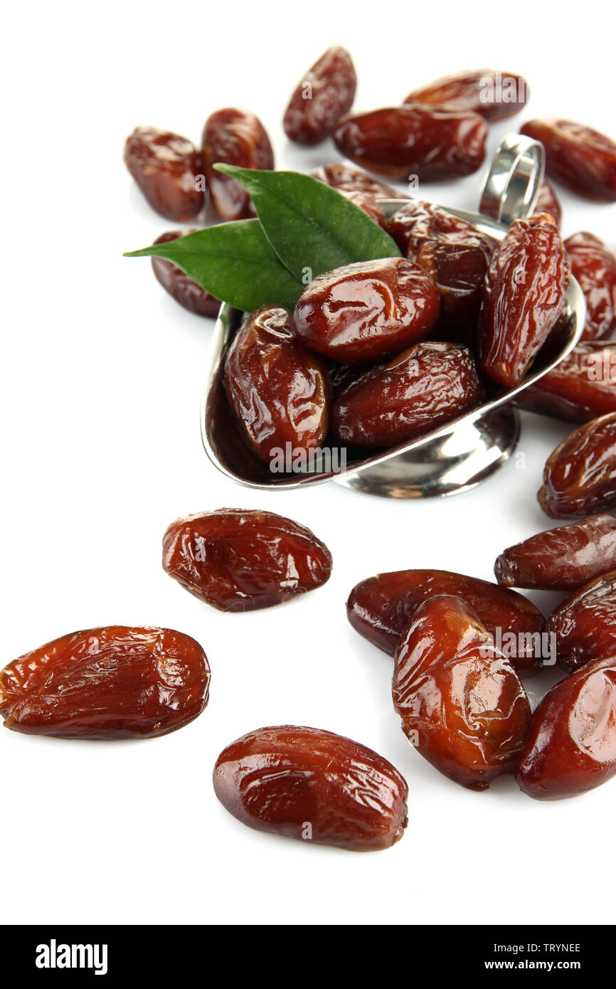 Dried dates in metal dish isolated on white Stock Photo - Alamy