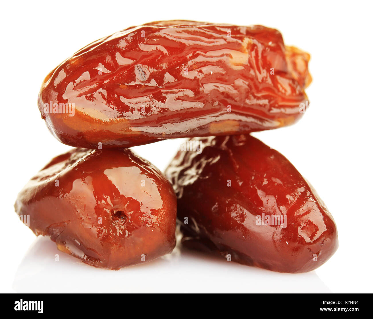 Dried dates isolated on white Stock Photo - Alamy