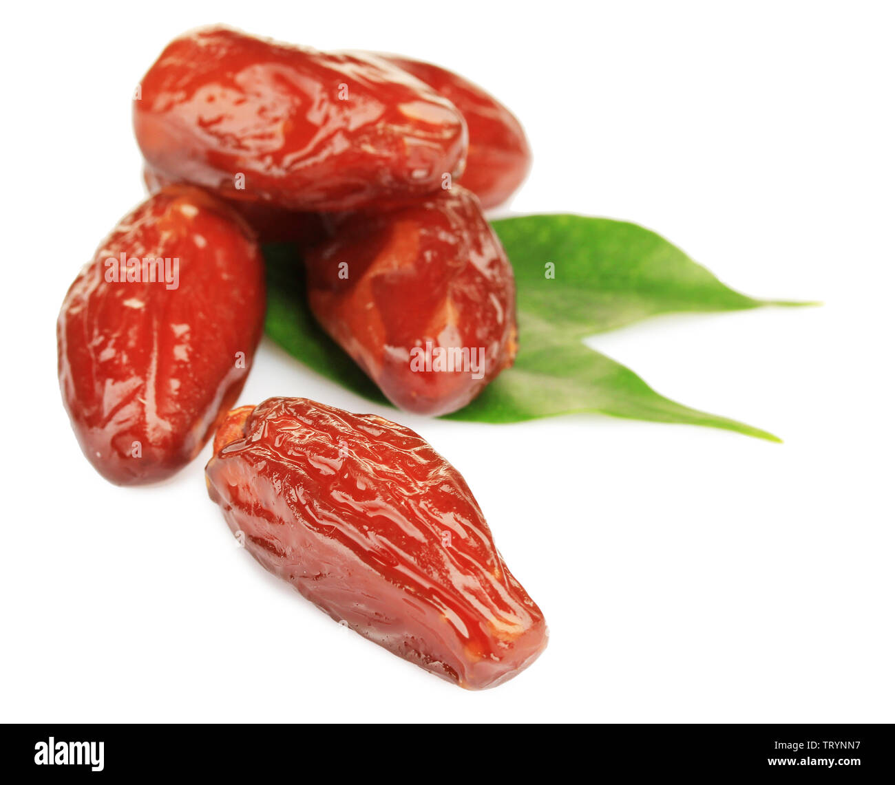 Dried dates isolated on white Stock Photo - Alamy