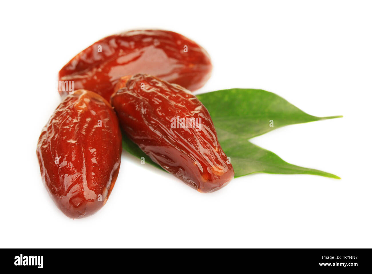 Dried dates isolated on white Stock Photo - Alamy