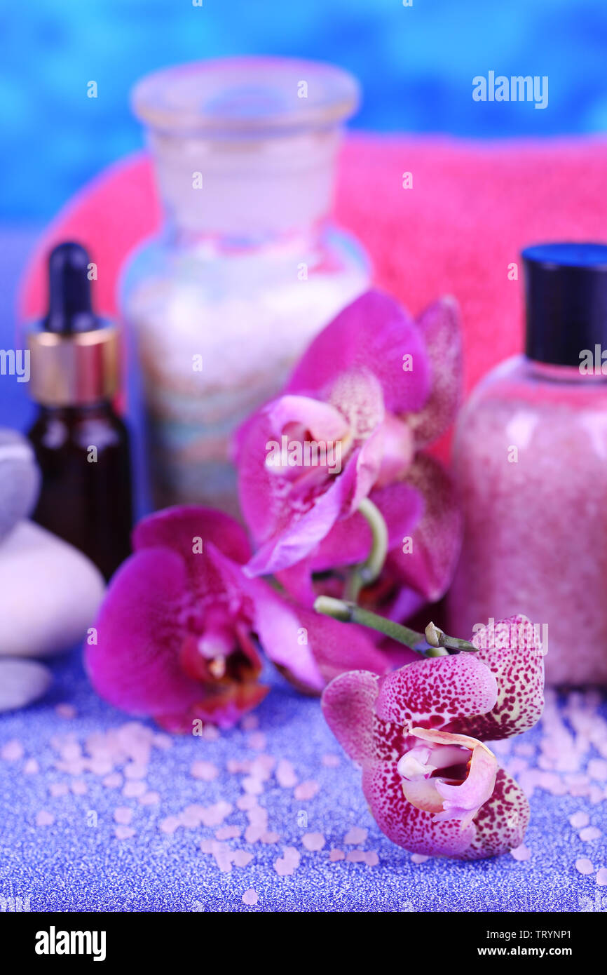 Beautiful spa setting with orchid on blue background Stock Photo - Alamy
