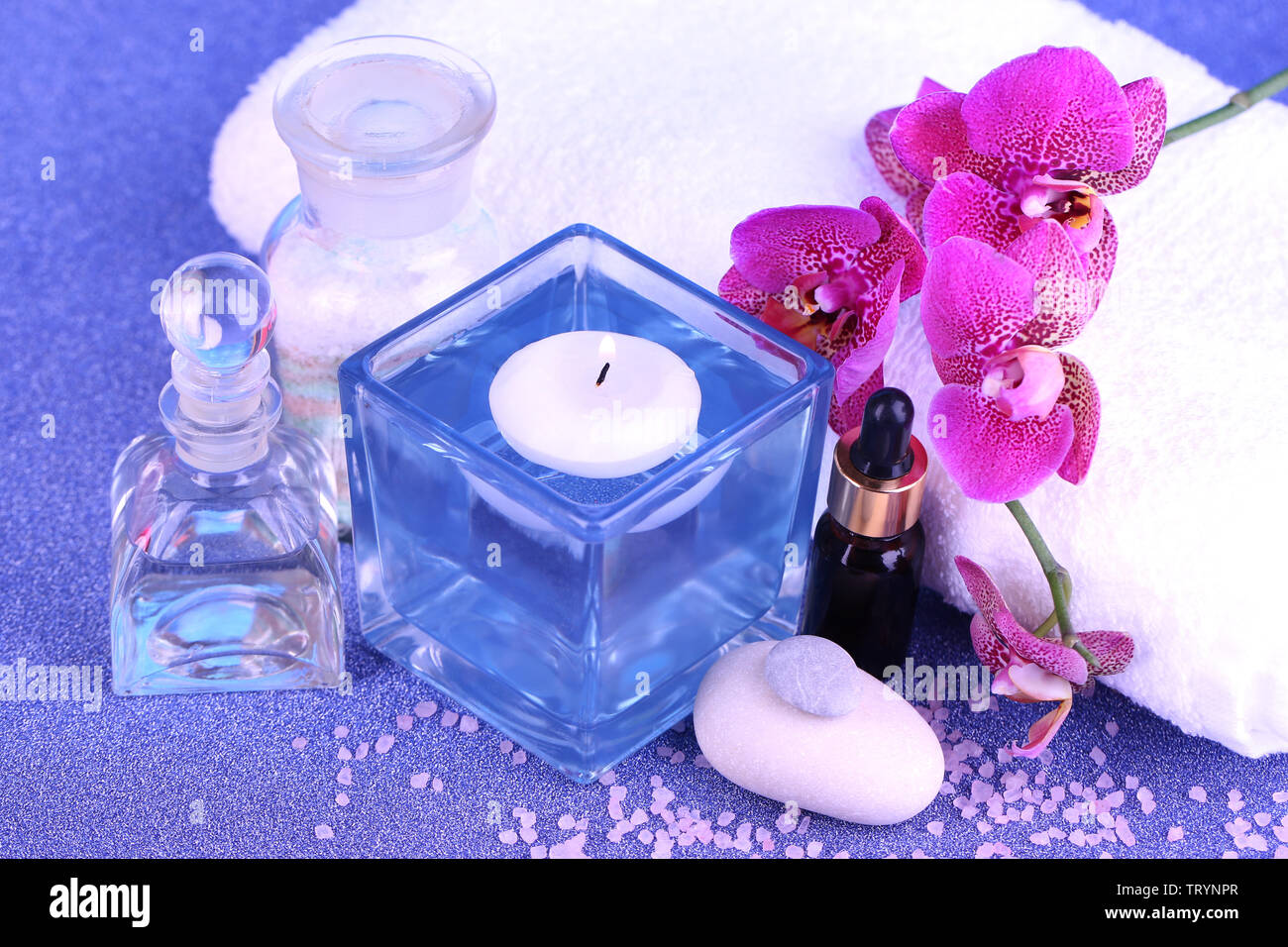 Beautiful spa setting with orchid on blue background Stock Photo - Alamy