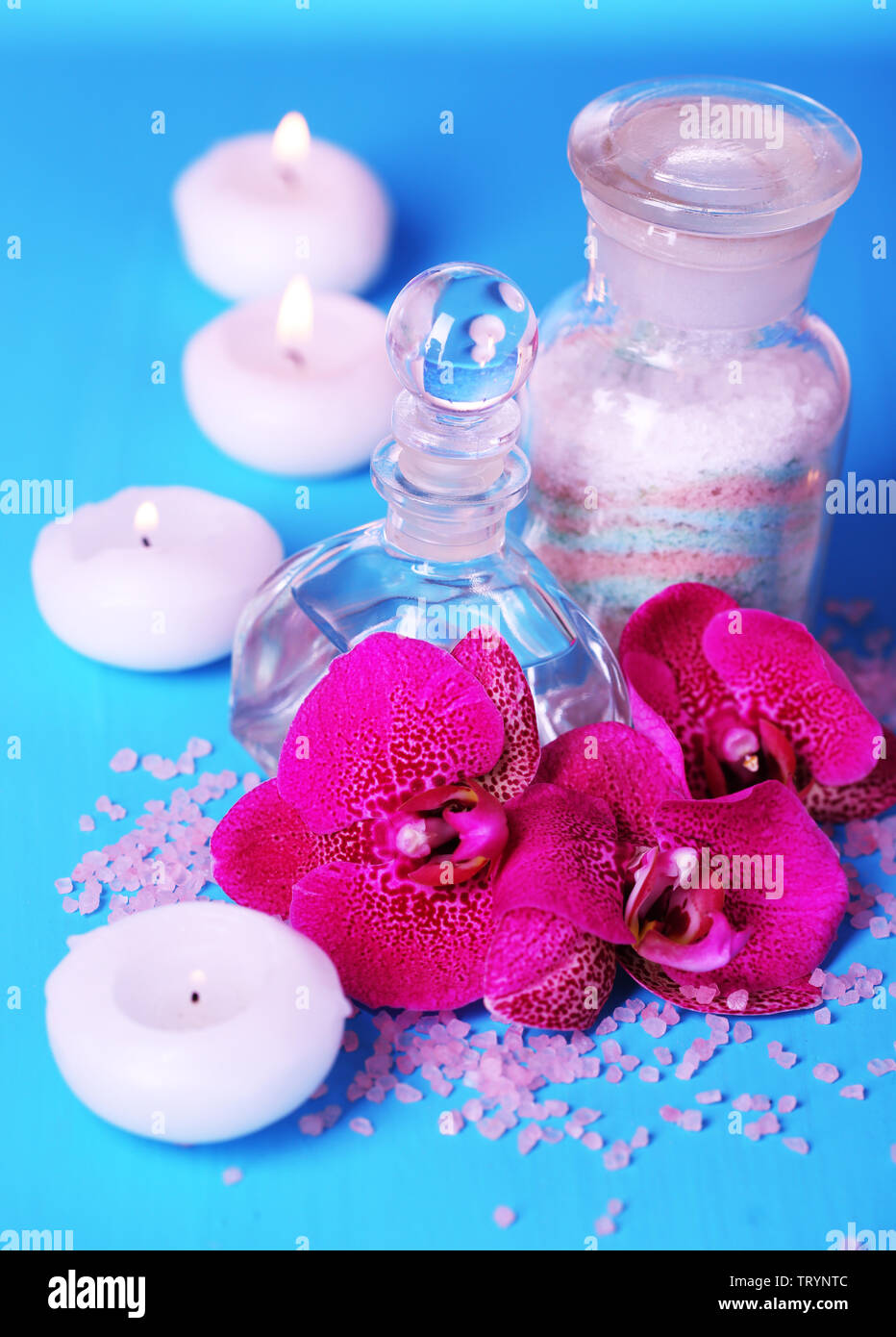 Beautiful spa setting with orchid on blue background Stock Photo - Alamy