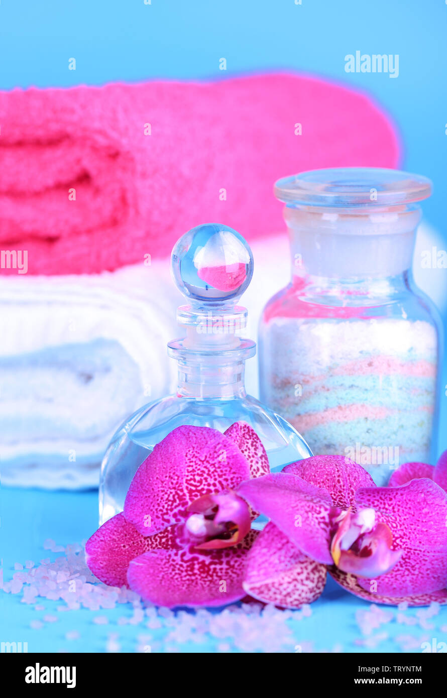 Beautiful spa setting with orchid on blue background Stock Photo - Alamy