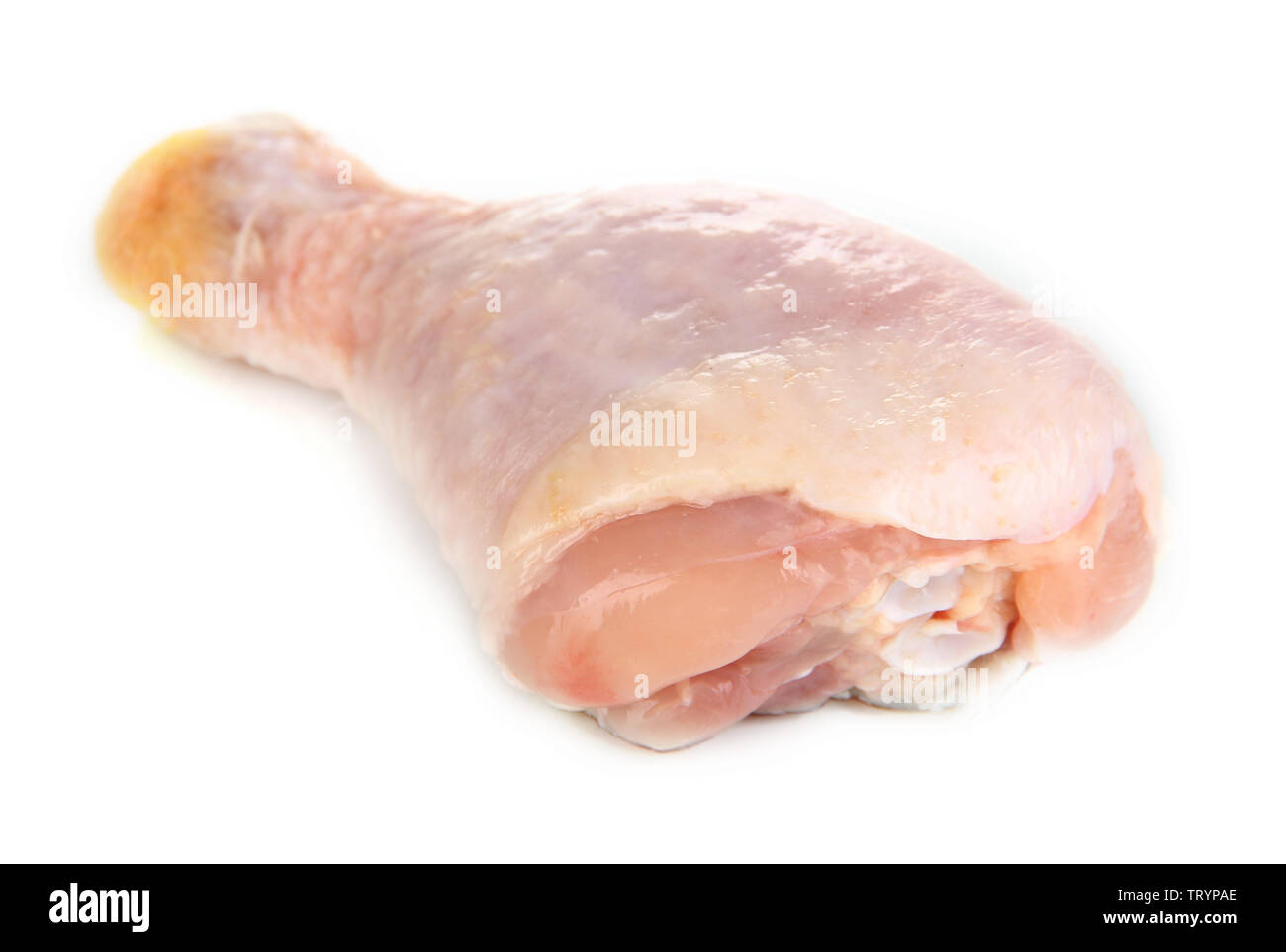 Raw chicken leg isolated on white Stock Photo - Alamy