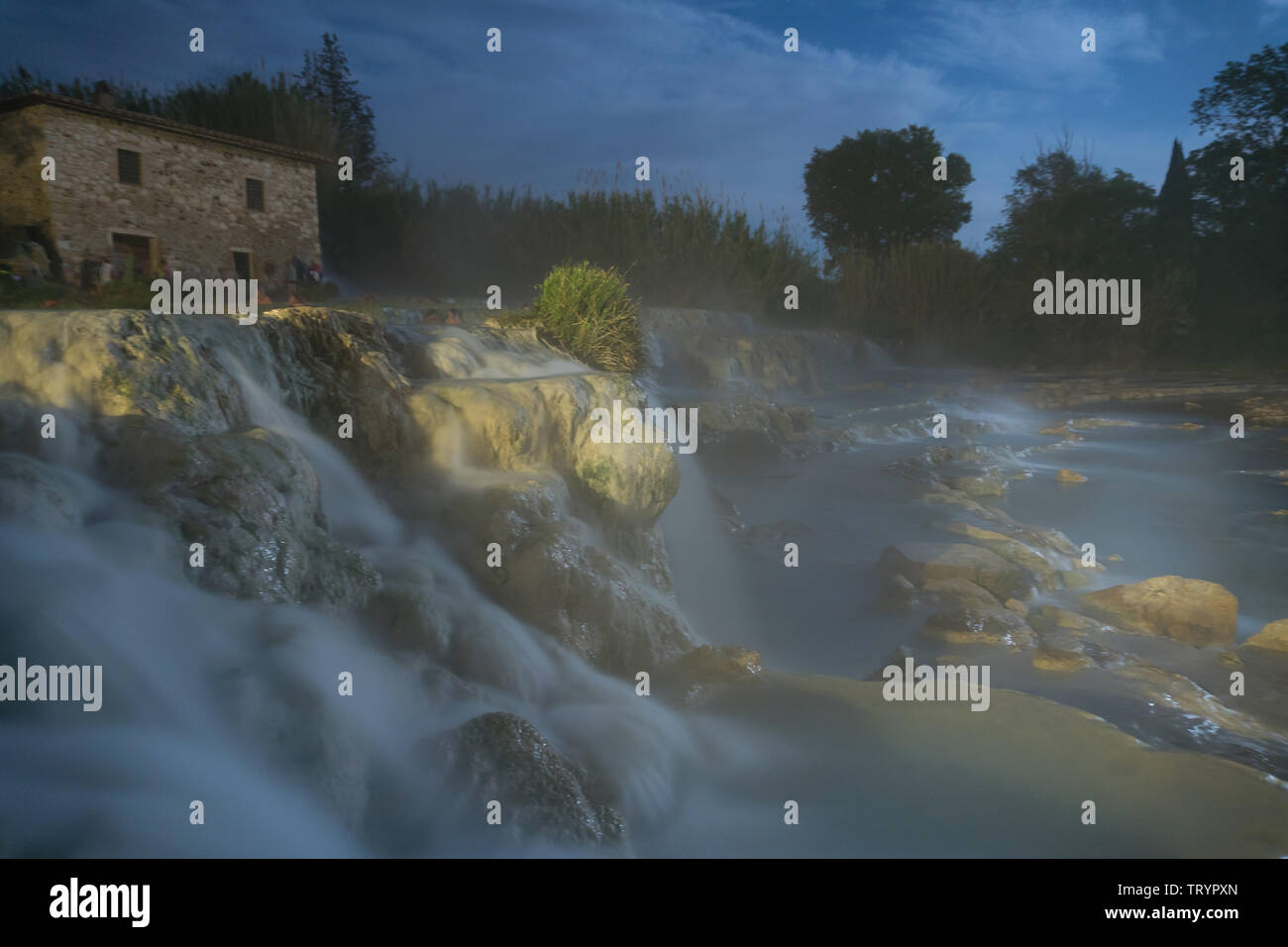 Night view of the famous free spa of the mill in Saturnia in Tuscany ...