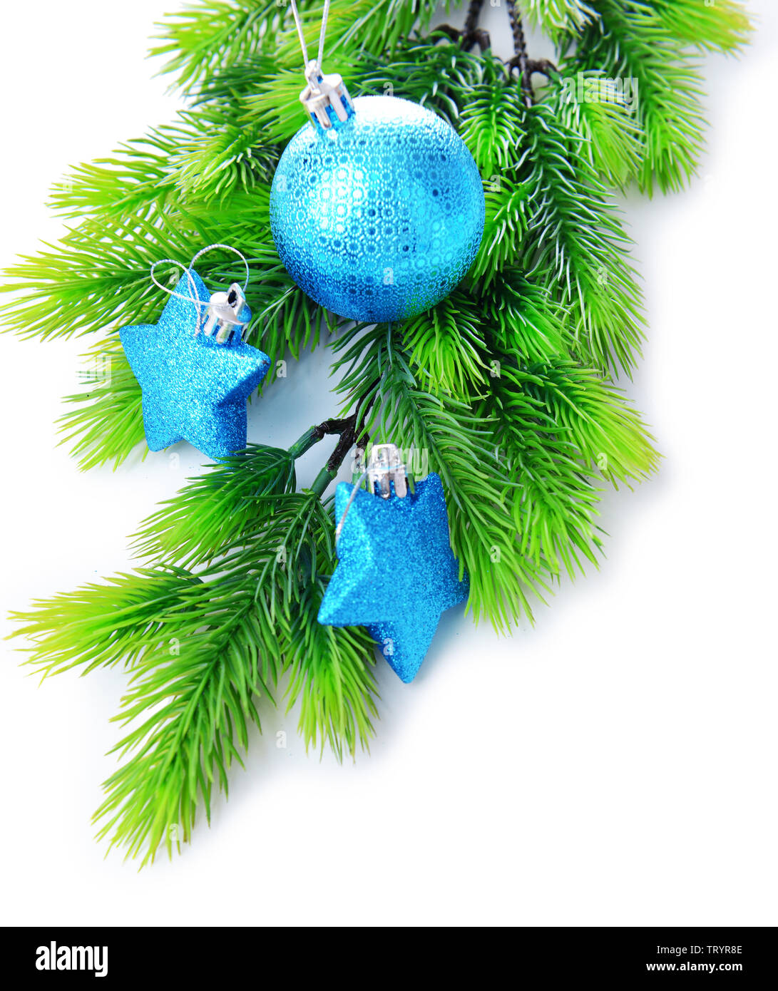 Christmas balls and decorative stars on fir tree, isolated on white ...