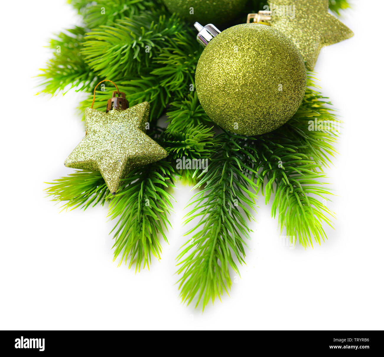 Christmas balls and decorative stars on fir tree, isolated on white ...