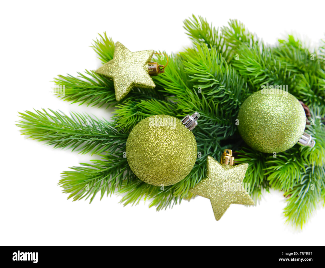Christmas balls and decorative stars on fir tree, isolated on white ...