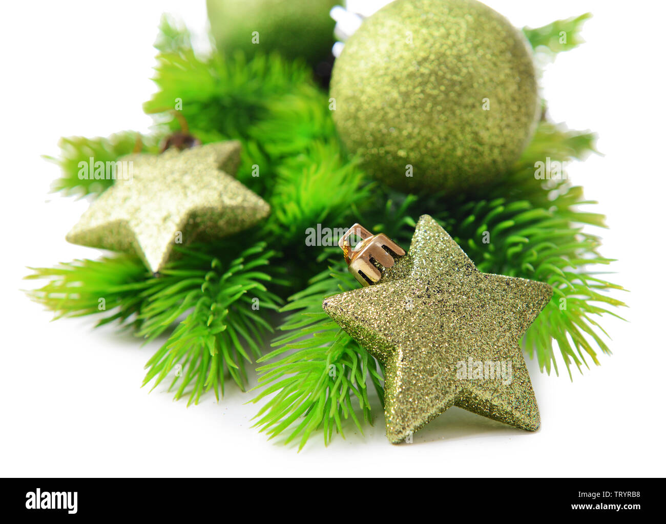 Christmas balls and decorative stars on fir tree, isolated on white ...