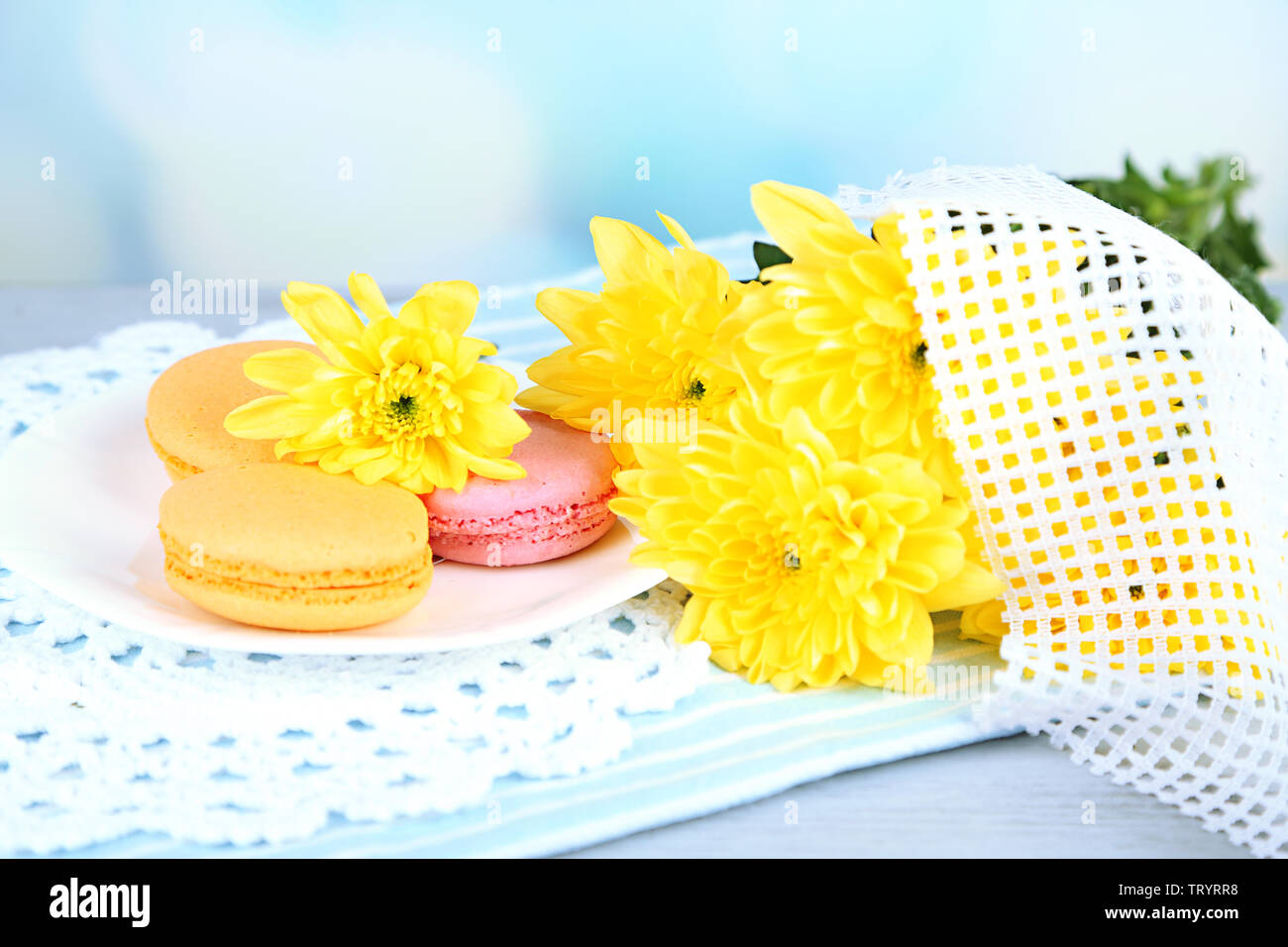 Beautiful flowers and macaroni on light background Stock Photo - Alamy