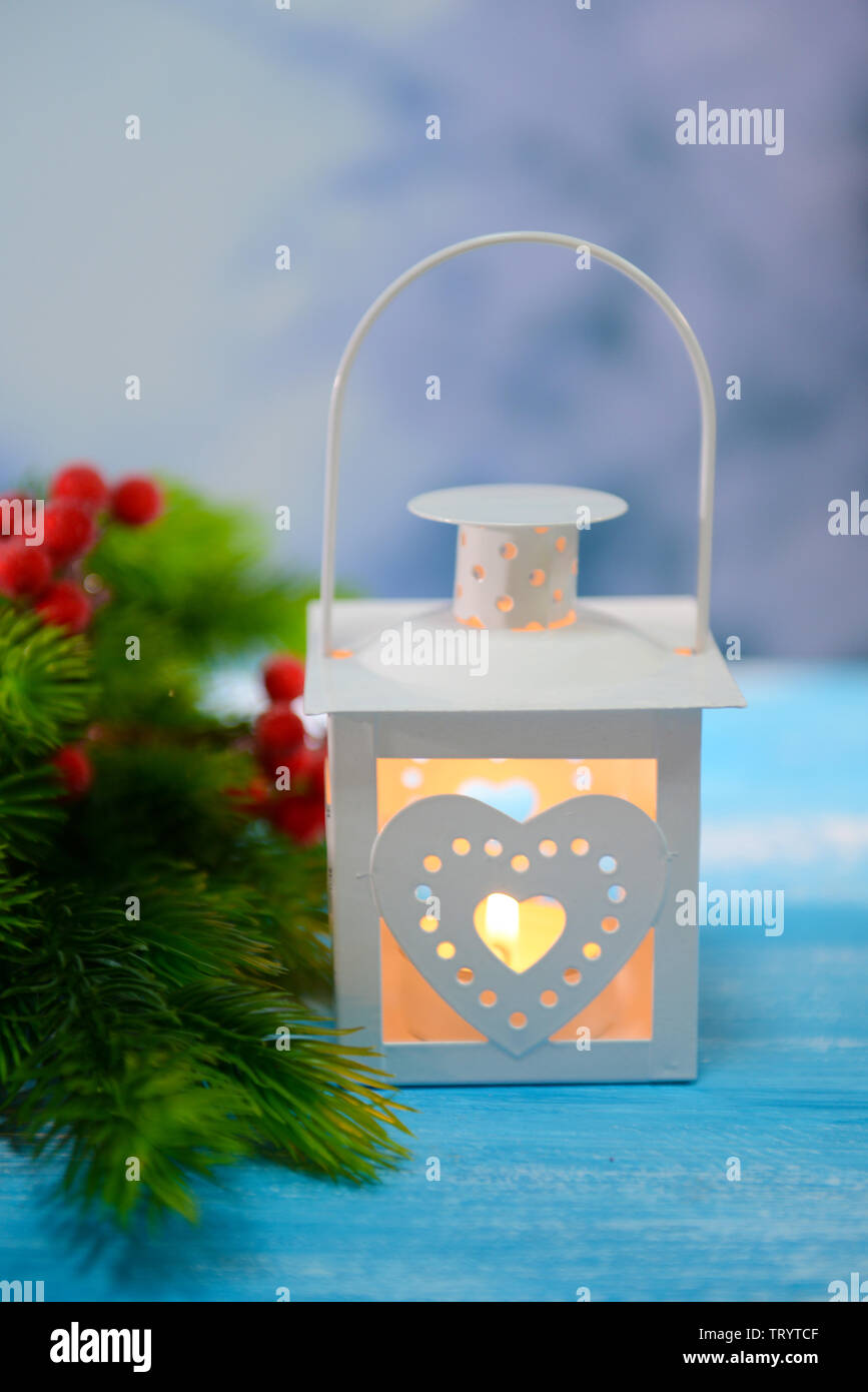 Christmas lantern, fir tree and decorations on light background Stock ...