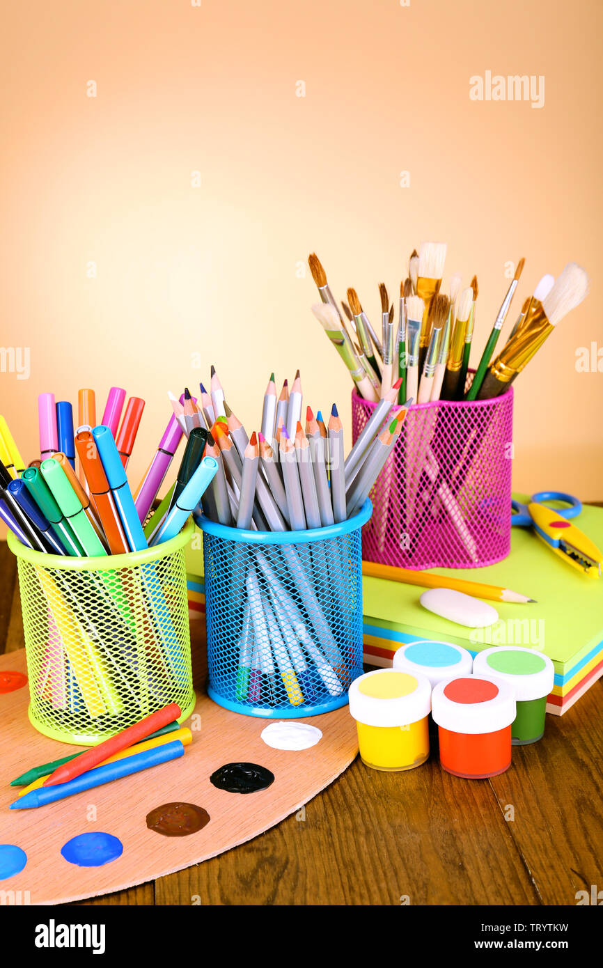 Composition of various creative tools on table on beige background ...
