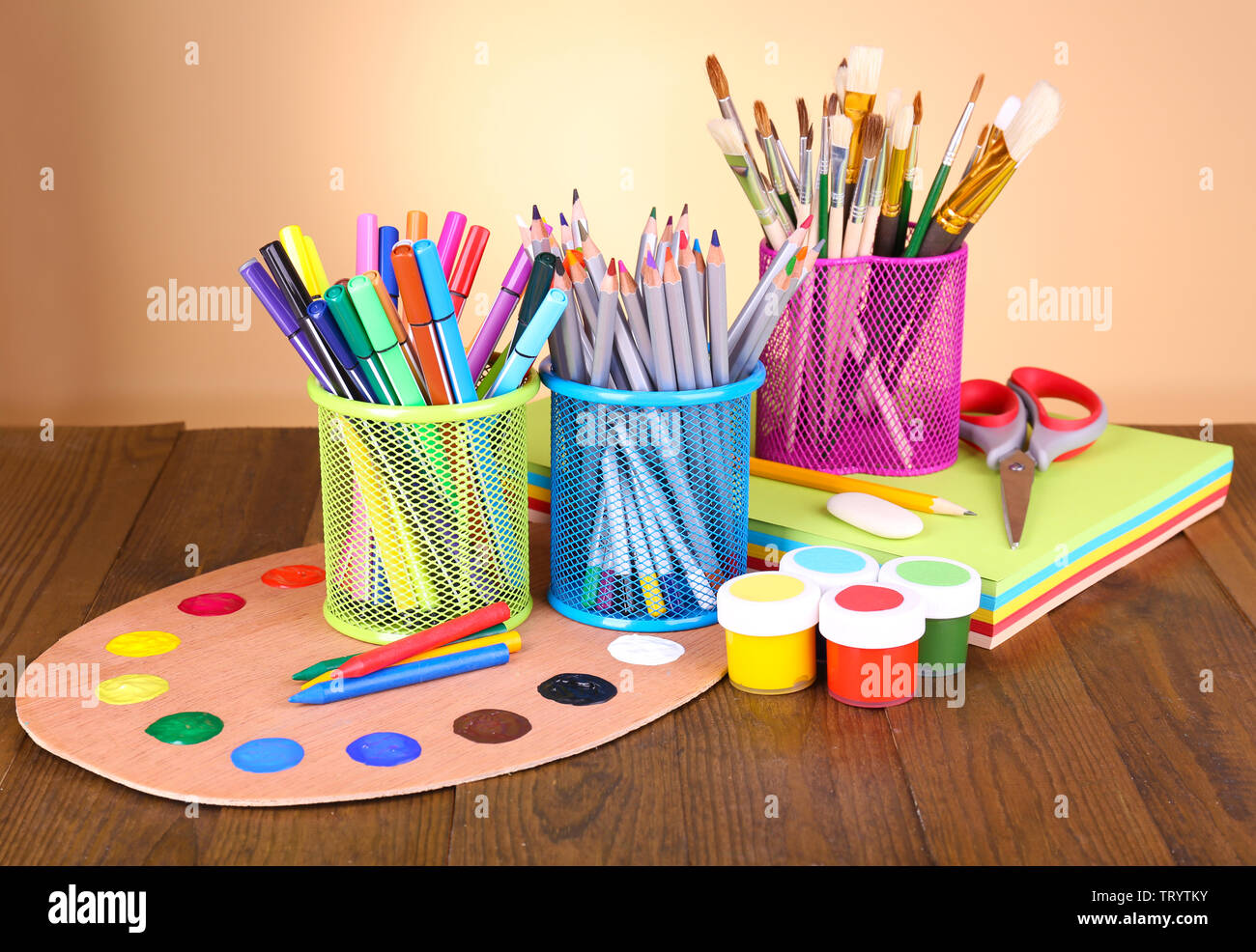 Composition of various creative tools on table on beige background ...