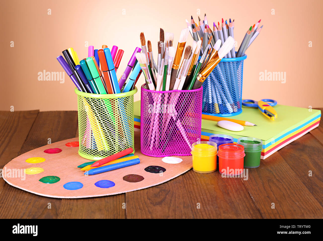 Composition of various creative tools on table on beige background ...