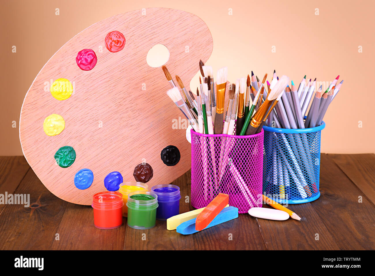 Composition of various creative tools on table on beige background ...