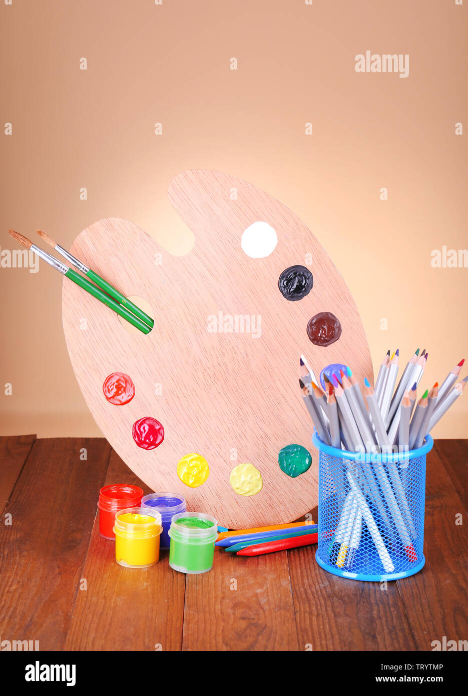 Composition of various creative tools on table on beige background ...