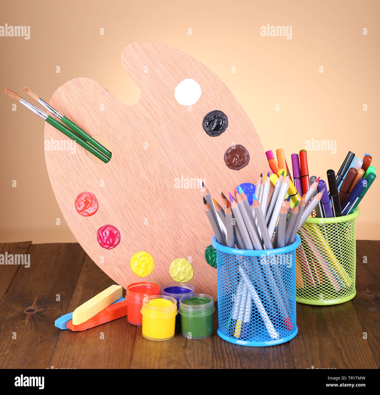 Composition of various creative tools on table on beige background ...