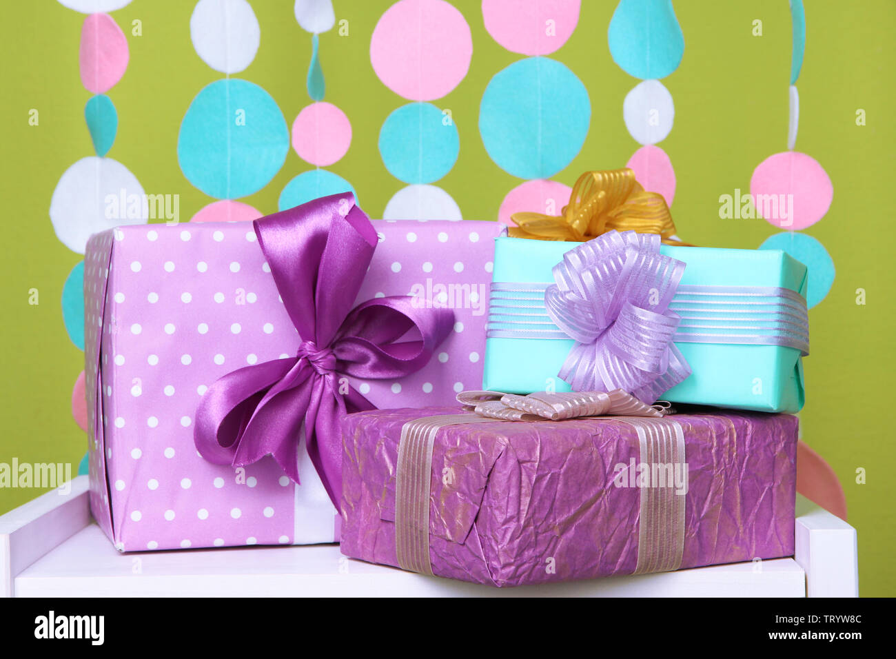Beautiful presents on table on bright background Stock Photo - Alamy