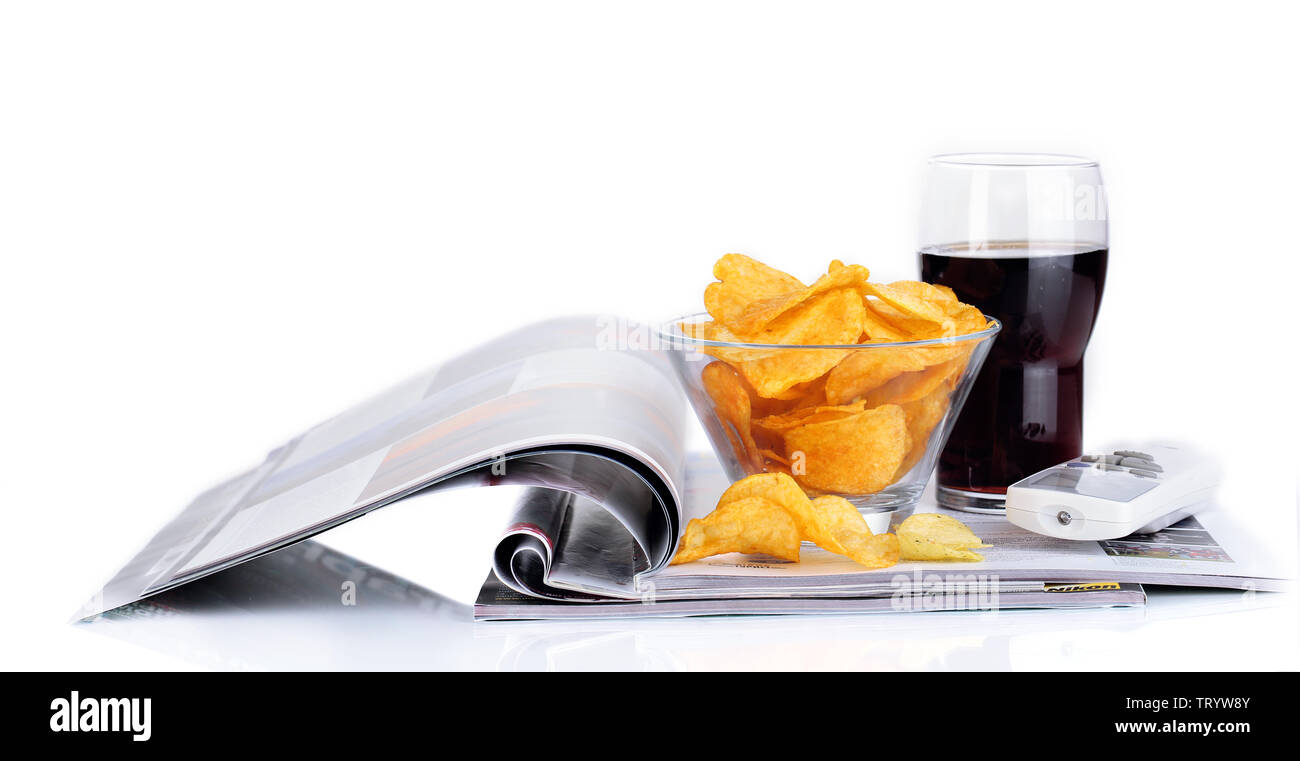 Chips in bowl, cola and TV remote isolated on white Stock Photo - Alamy