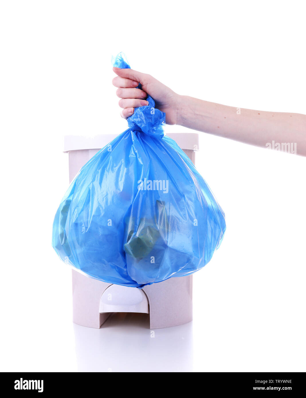 Hand holding trash bag, isolated on white Stock Photo - Alamy