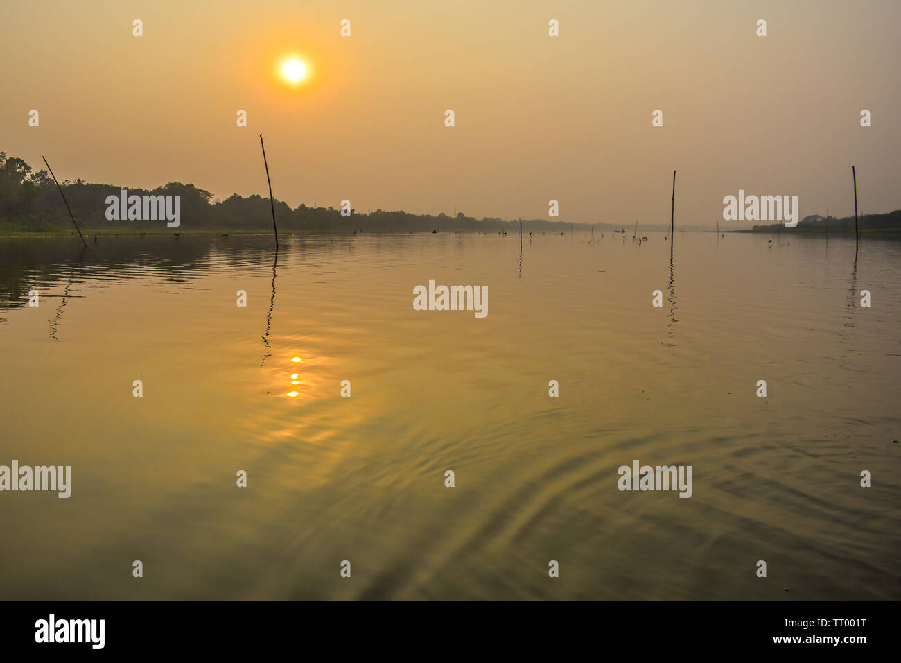 A stunning, natural dramatic, blazing sunset with reflection on over ...