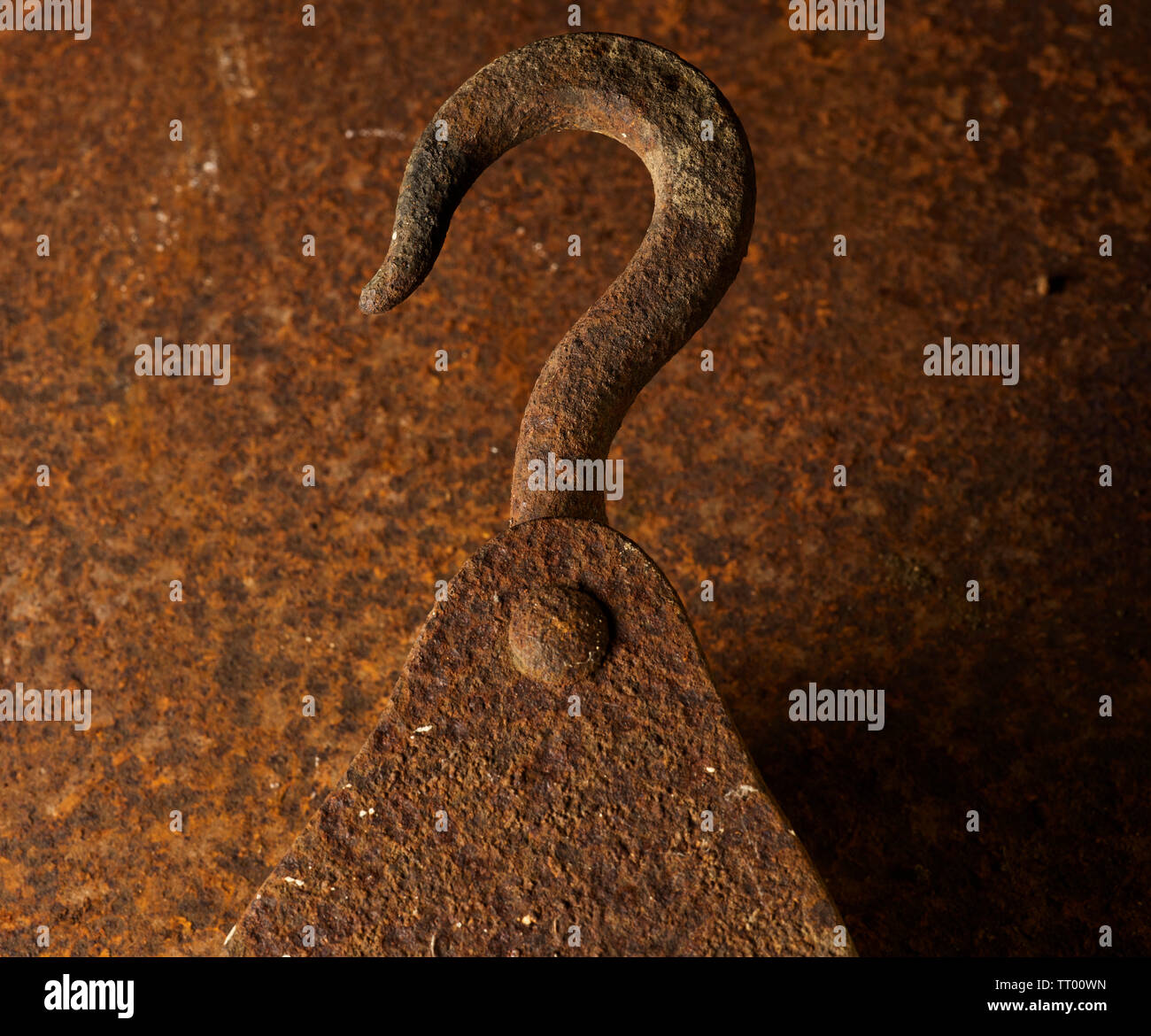 Rusty hook on a rusty background Stock Photo - Alamy