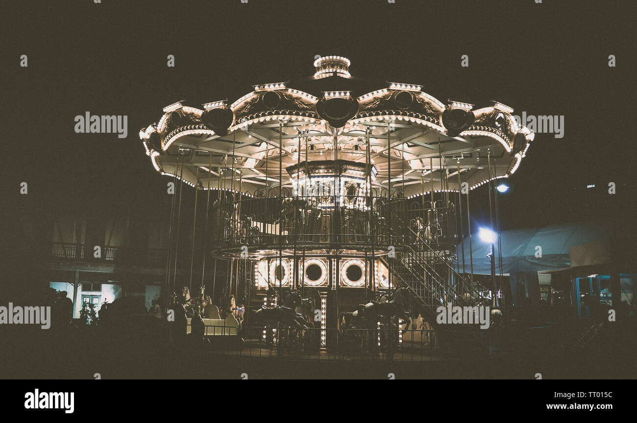 Merry-Go-Round (carousel) illuminated at night Stock Photo - Alamy