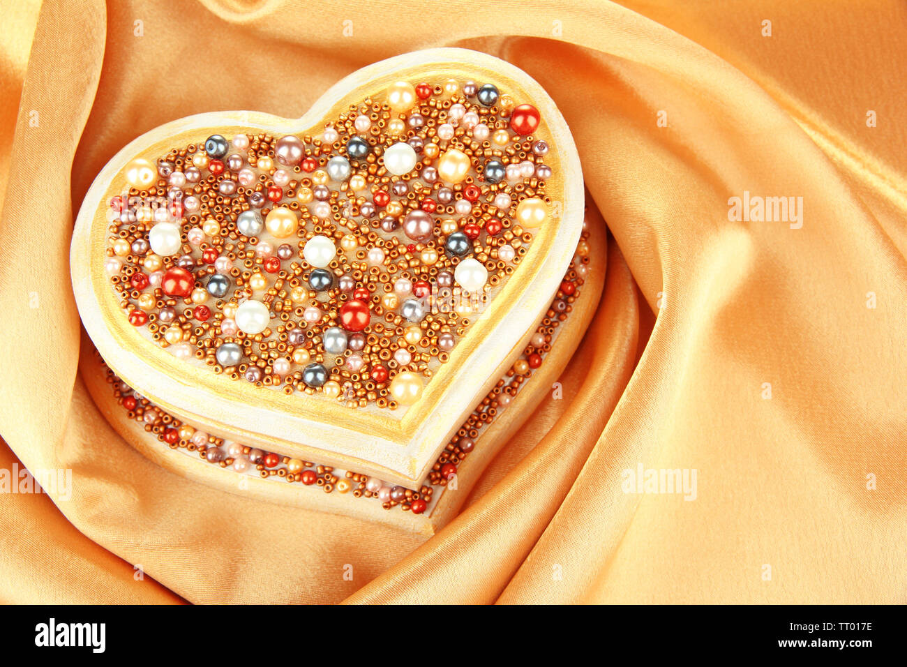 Beautiful hand made casket, on silk background Stock Photo - Alamy
