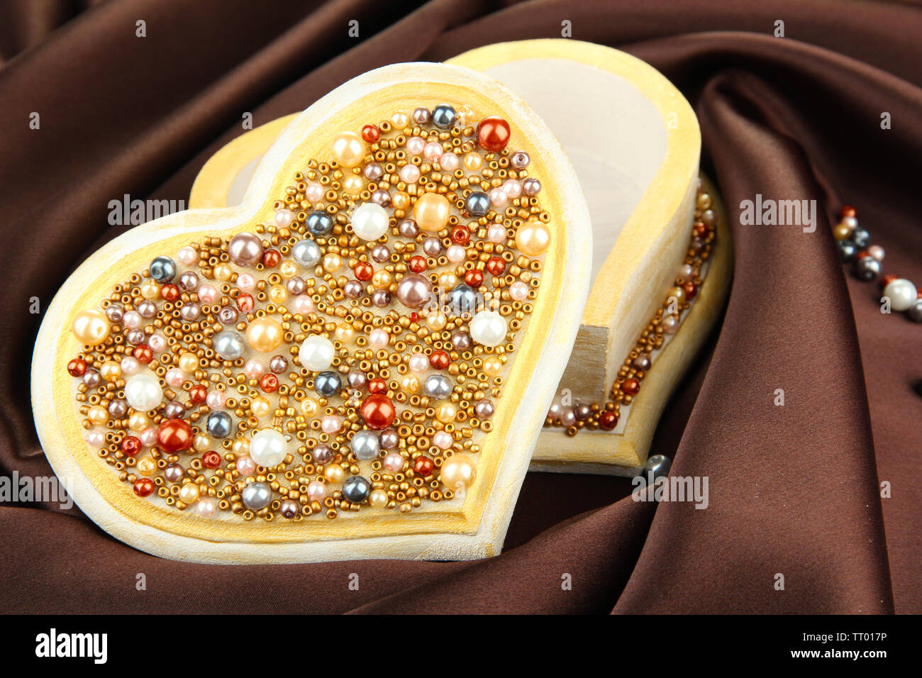 Beautiful hand made casket, on silk background Stock Photo - Alamy