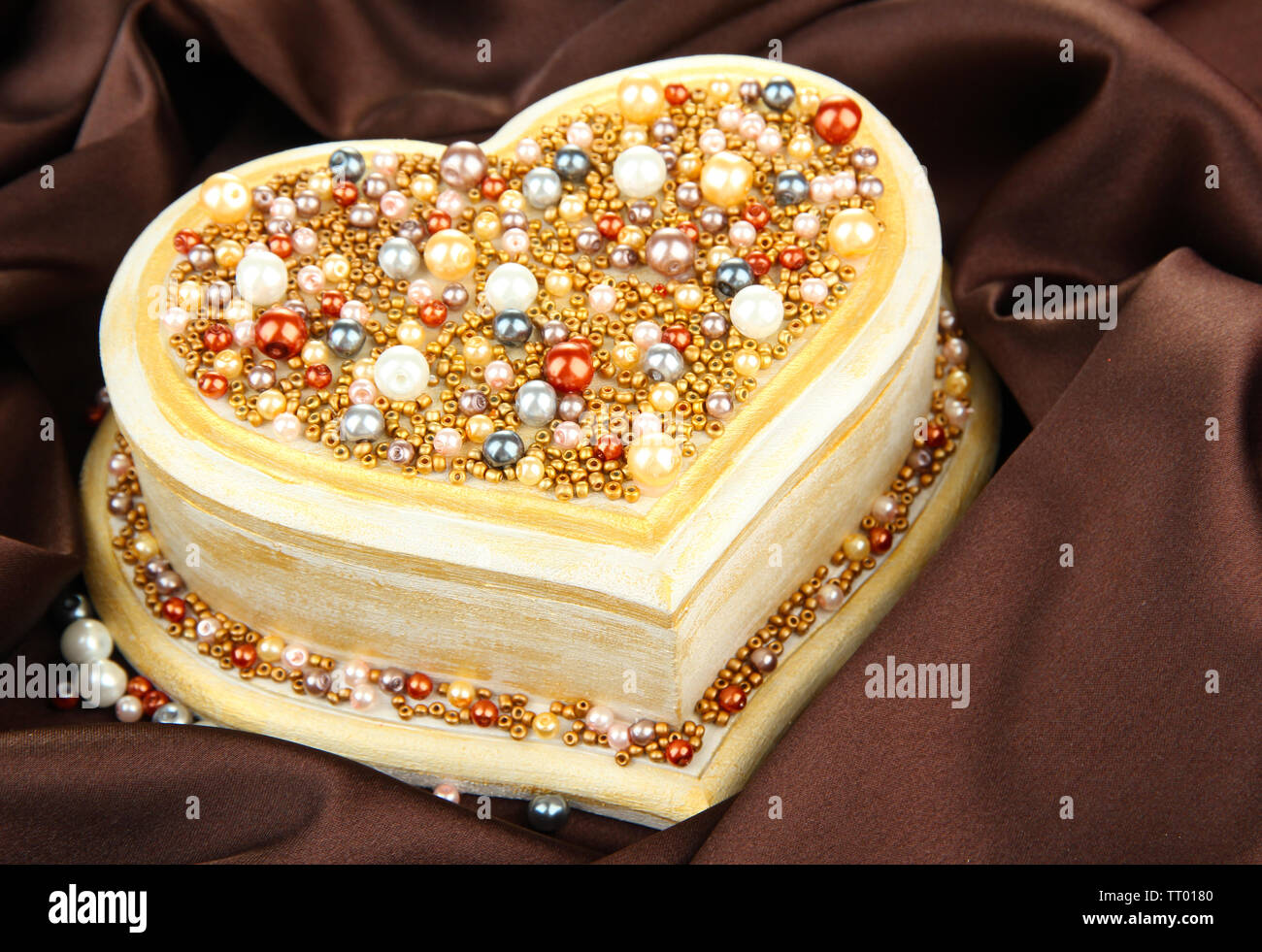 Beautiful hand made casket, on silk background Stock Photo - Alamy