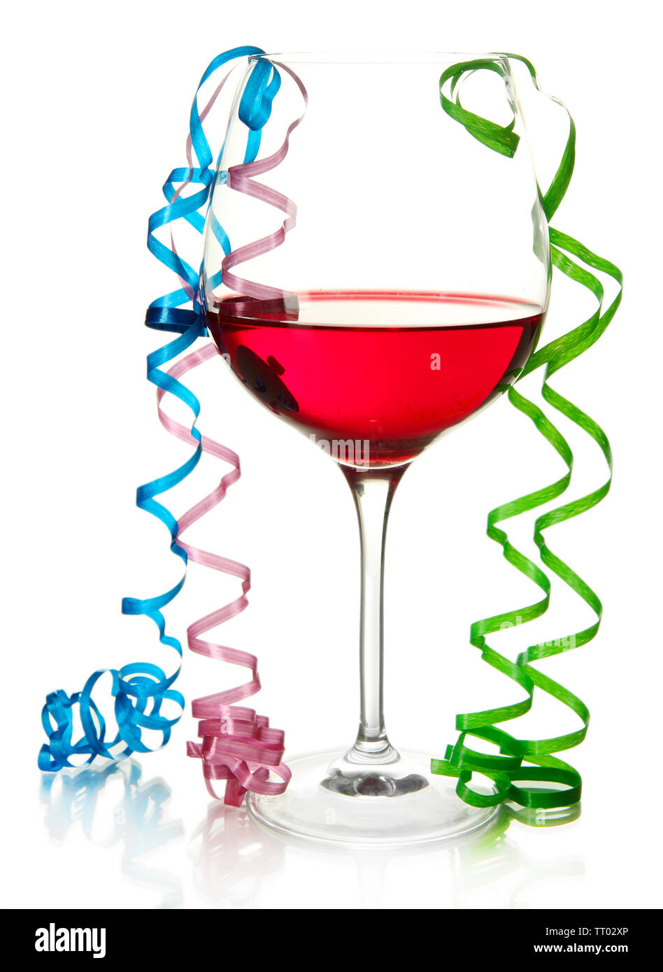 Glass of red wine and streamer after party isolated on white Stock ...