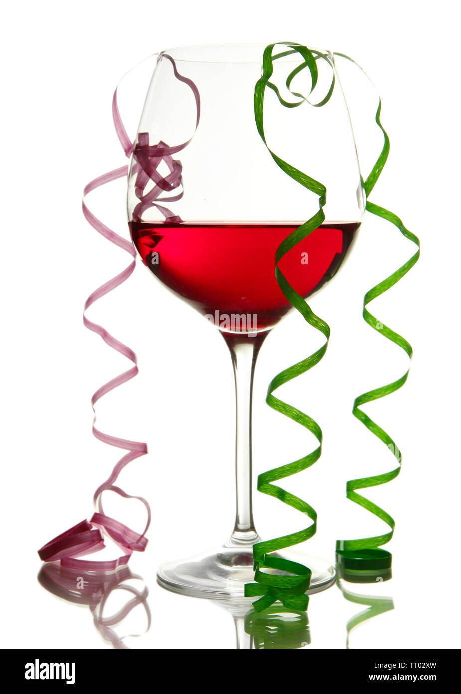 Glass of red wine and streamer after party isolated on white Stock ...