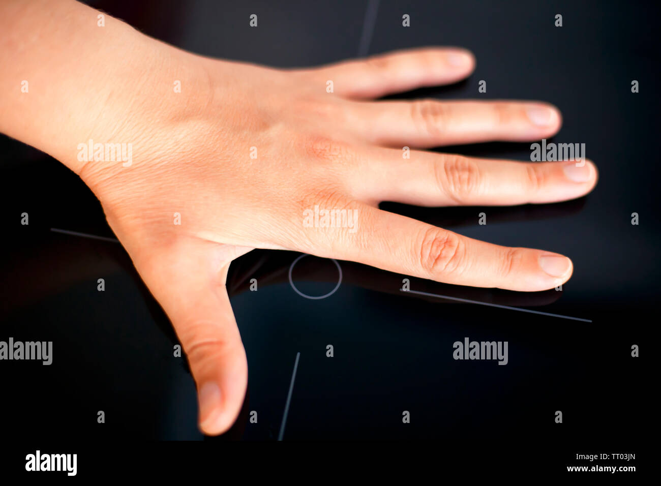 Induction cooktop hand hi-res stock photography and images - Alamy